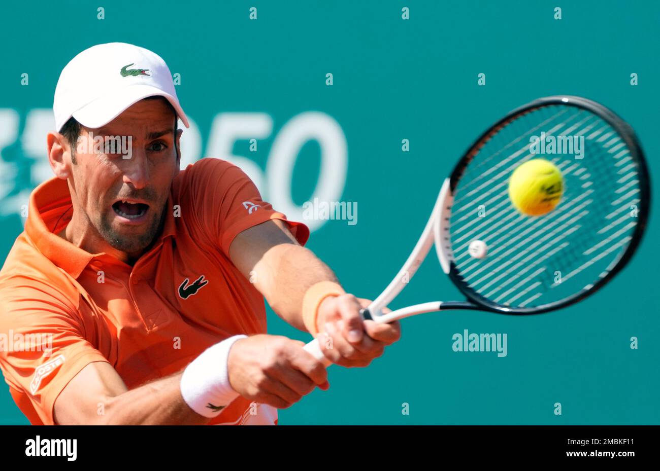 Novak Djokovic of Serbia returns a ball to Russia's Karen Khachanov ...