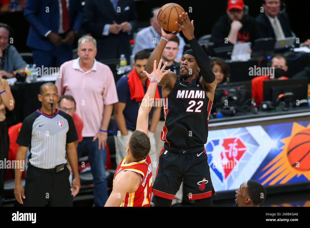 Miami Heat forward Jimmy Butler (22) shoots over Atlanta Hawks guard ...