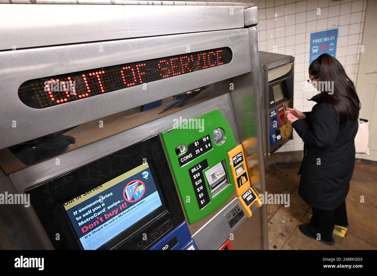 New York, USA. 20th Jan, 2023. A commuter seen using a vending machines ...