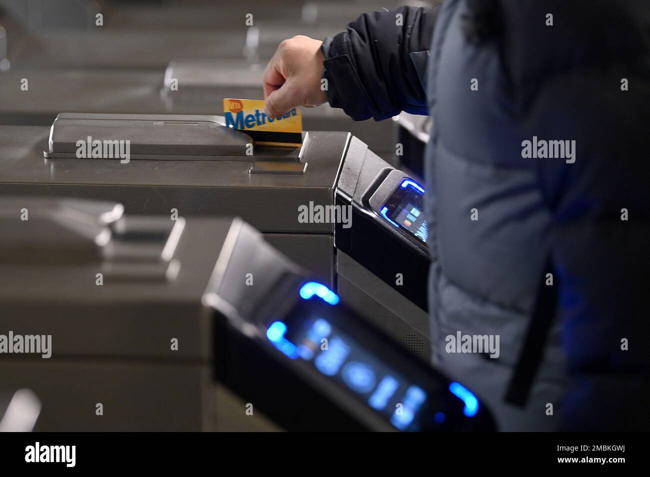 New York, USA. 20th Jan, 2023. A commuter is seen swiping an MTA ...