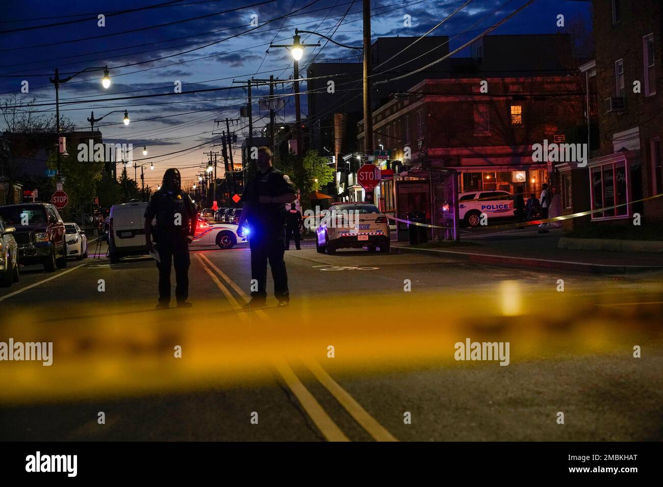 Police tape surrounds the scene after a second shooting Friday, April ...