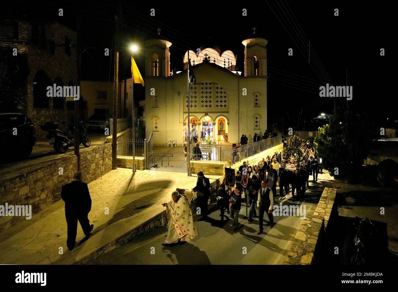 Greek Orthodox Christian worshipers hold aloft the bier depicting ...