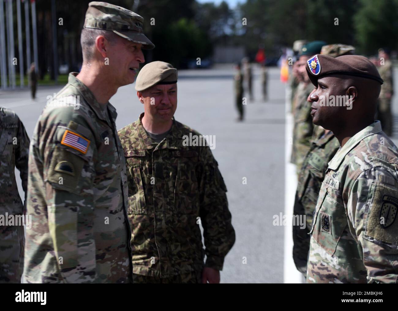 Army Gen. Daniel Hokanson, chief, National Guard Bureau, talks with ...