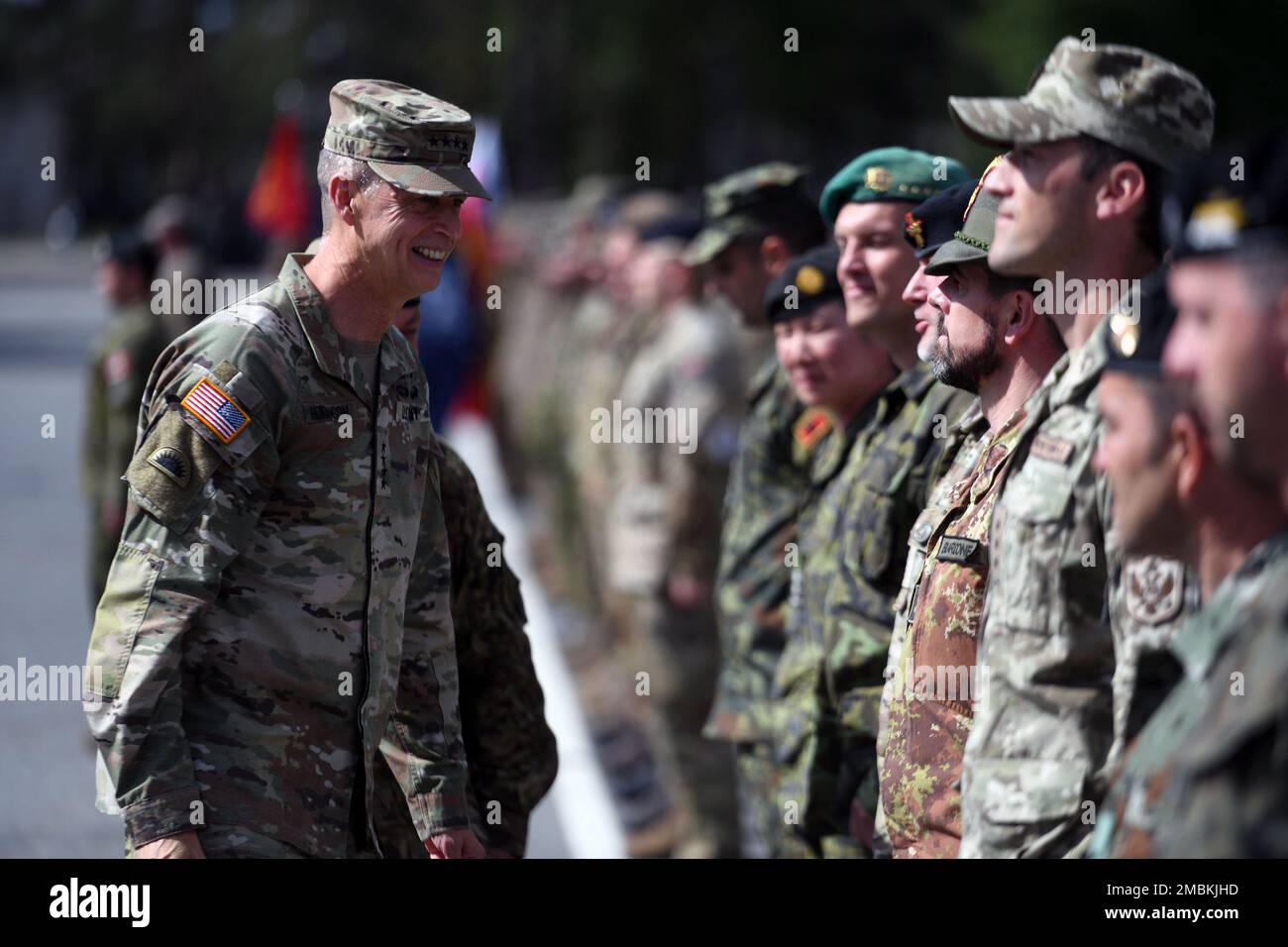 Army Gen. Daniel Hokanson, chief, National Guard Bureau, talks with ...