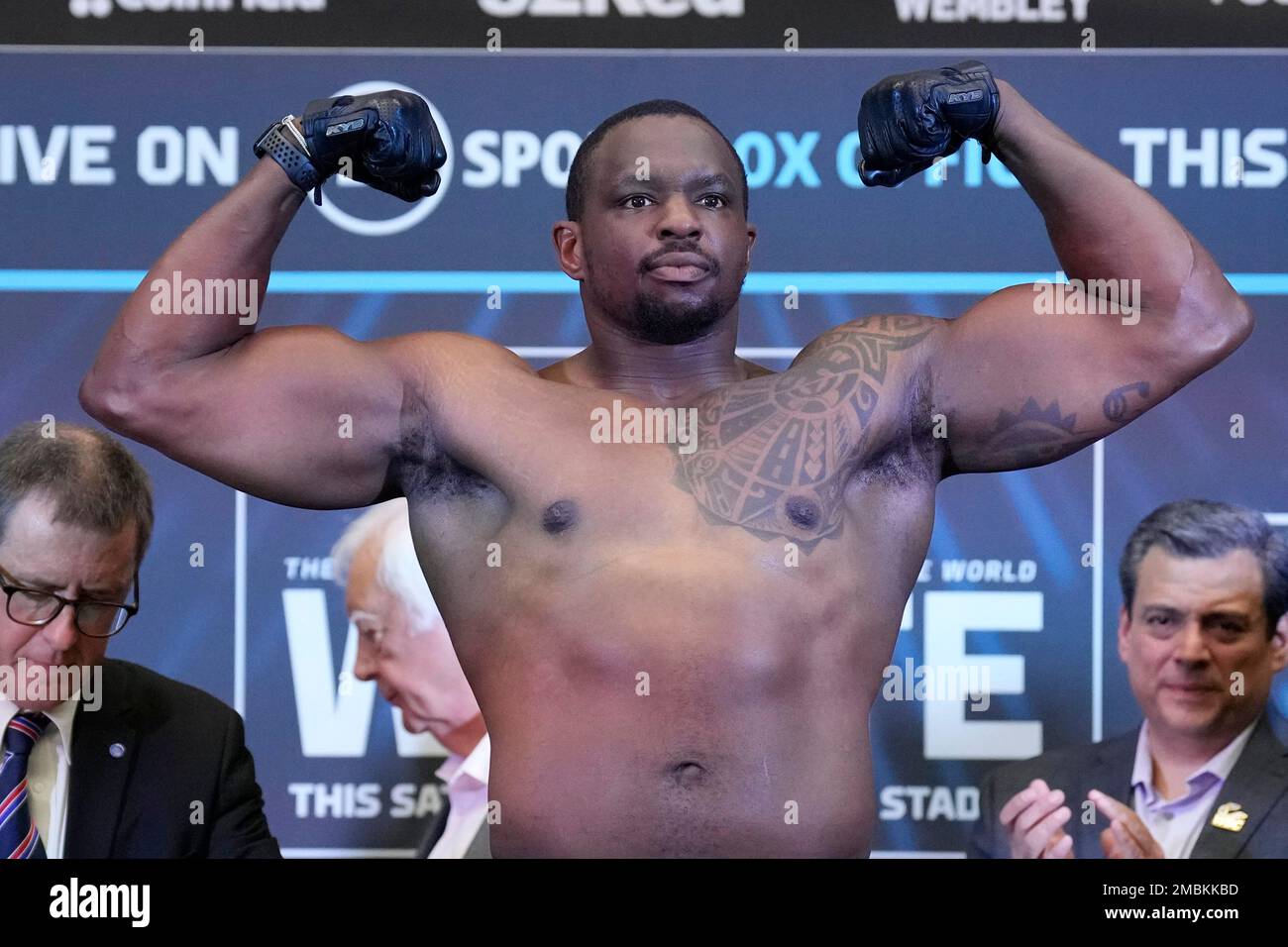British heavyweight boxer Dillian Whyte shows his muscles during weigh ...