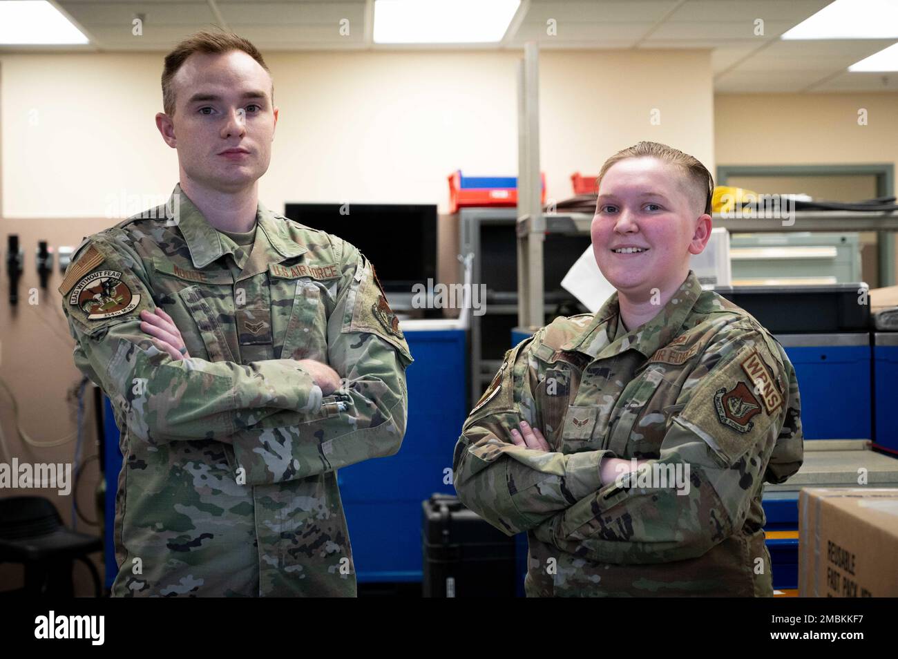 U.S. Air Force Airmen First Class Daniel Moore (left) and Airman First ...