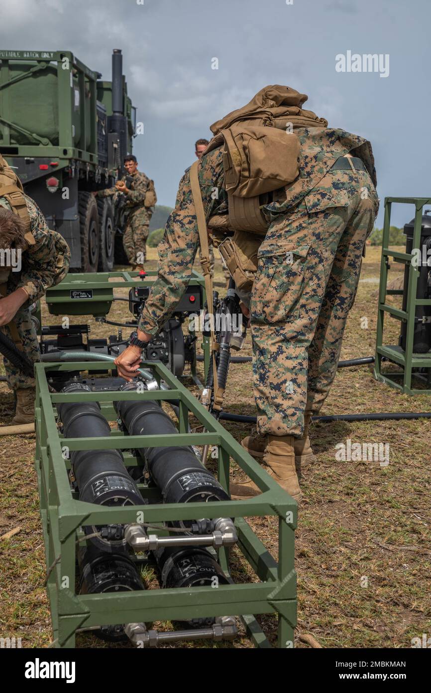 U.S. Marine Corps Lance Cpl. Ben Holstein, a water support technician ...