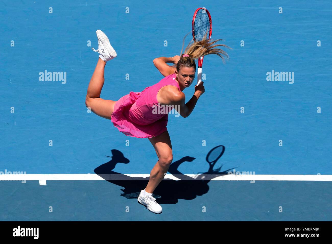 Camila Giorgi of Italy serves to Belinda Bencic of Switzerland during ...