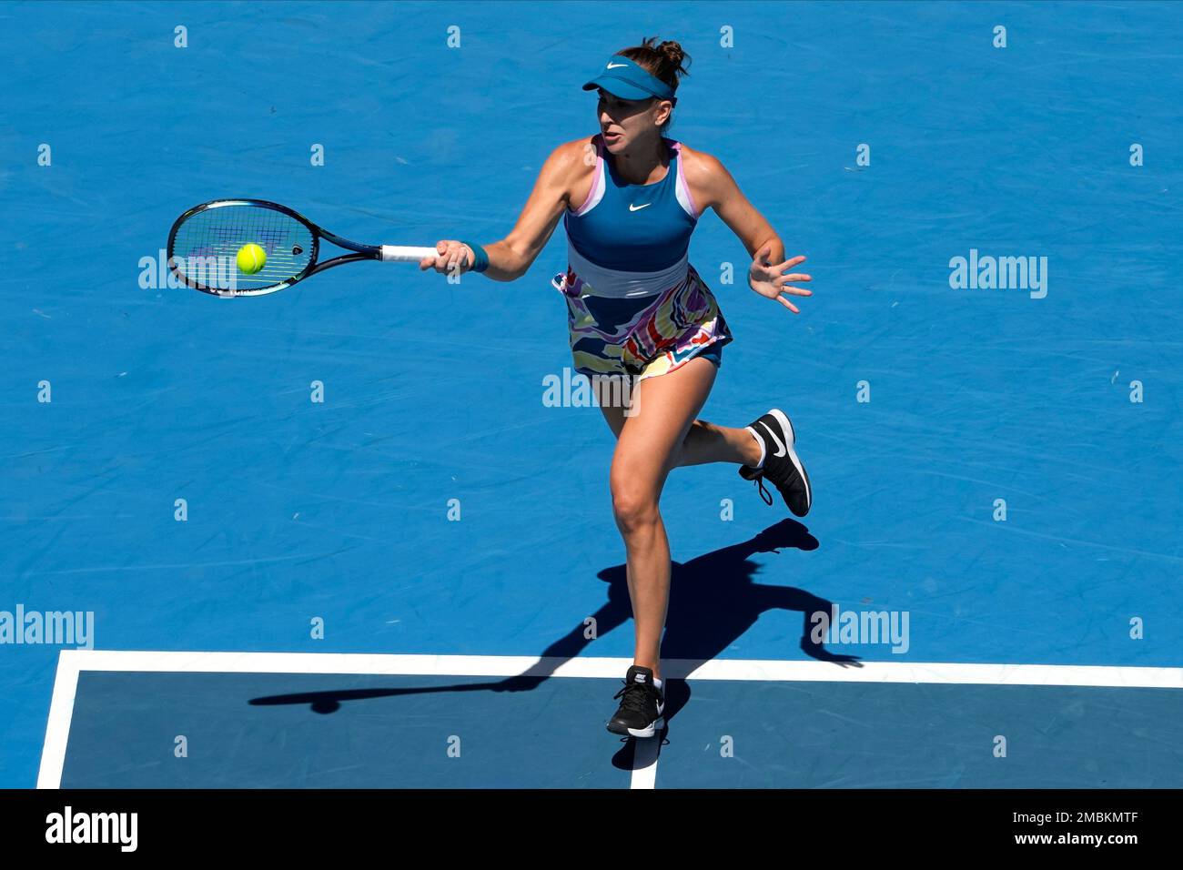 Belinda Bencic of Switzerland plays a forehand return to Camila Giorgi ...
