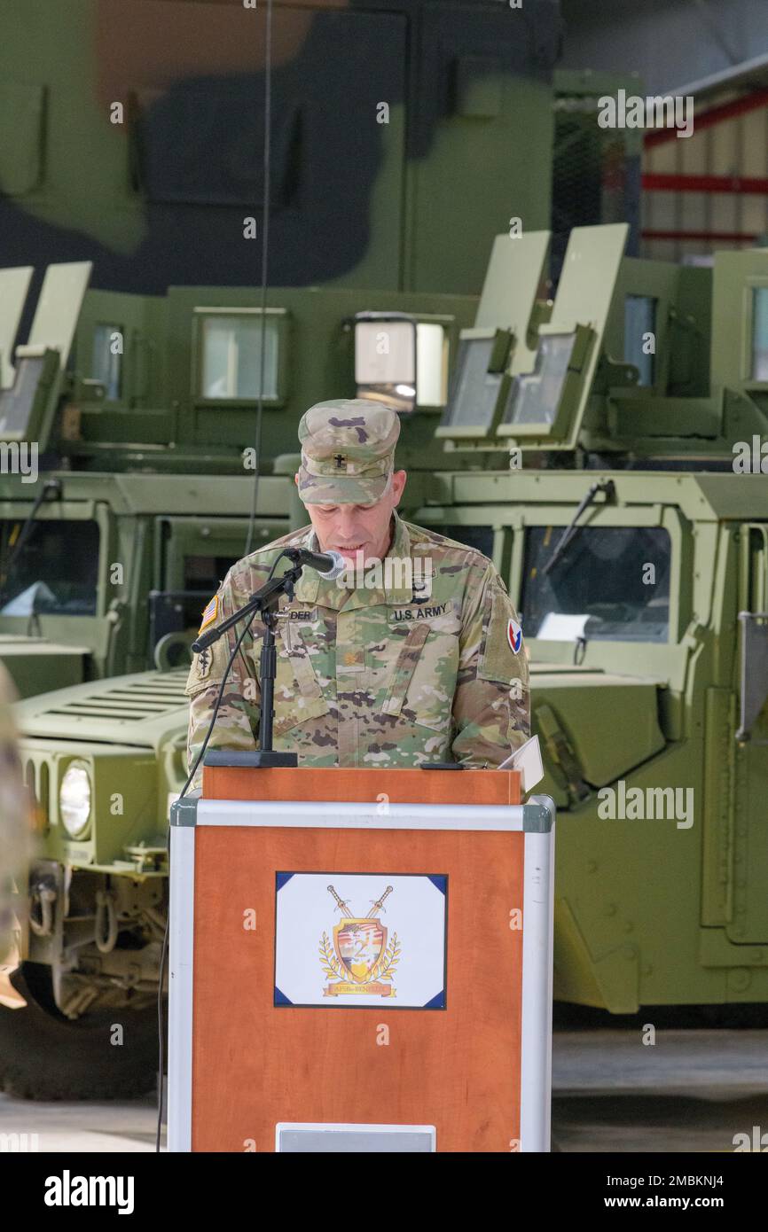 U.S. Army Chaplain, Maj. Matthew Holder gives the invocation during a ...