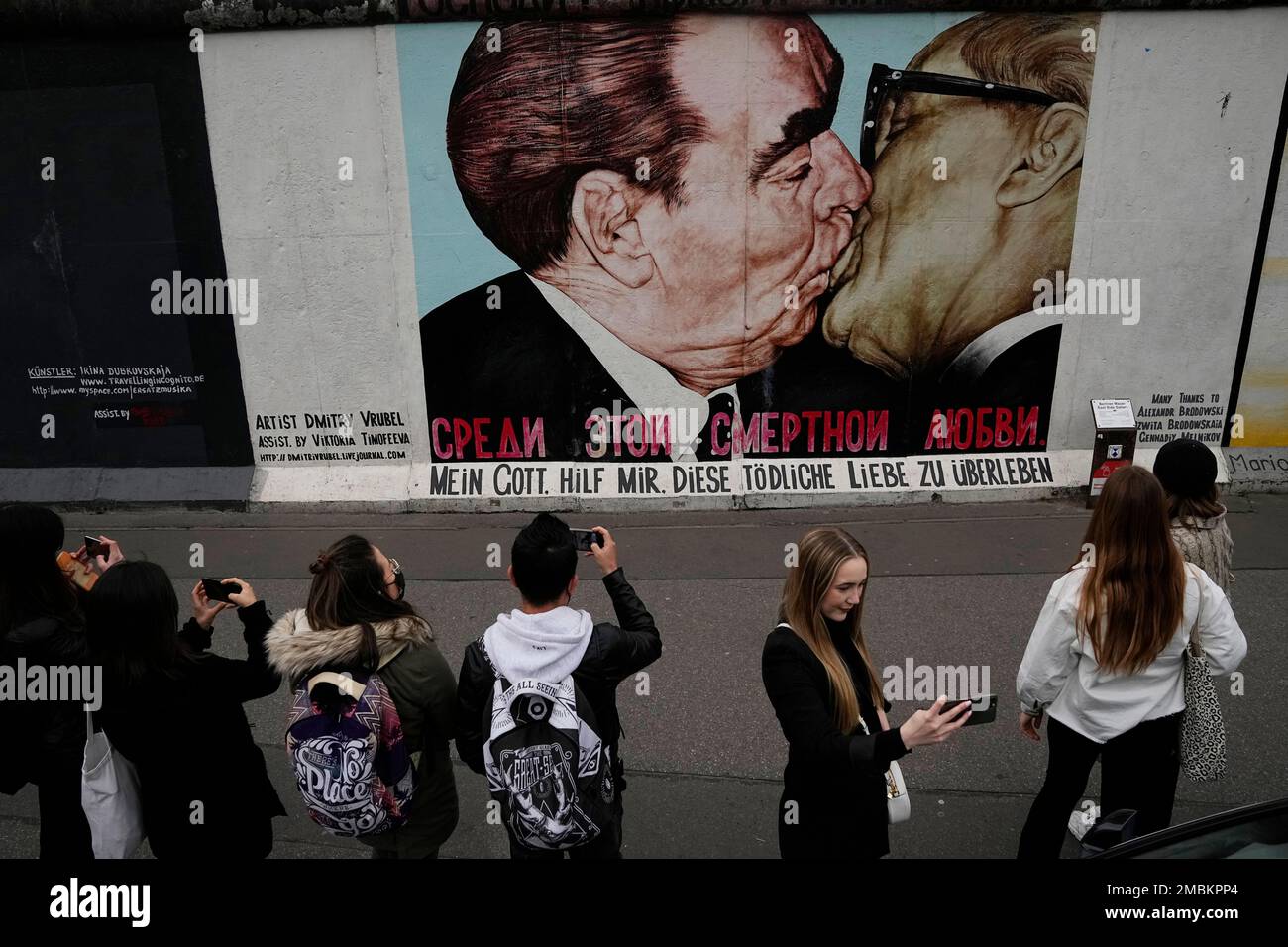 People take pictures of the artwork by Russian artist Dmitry Vrubel ...