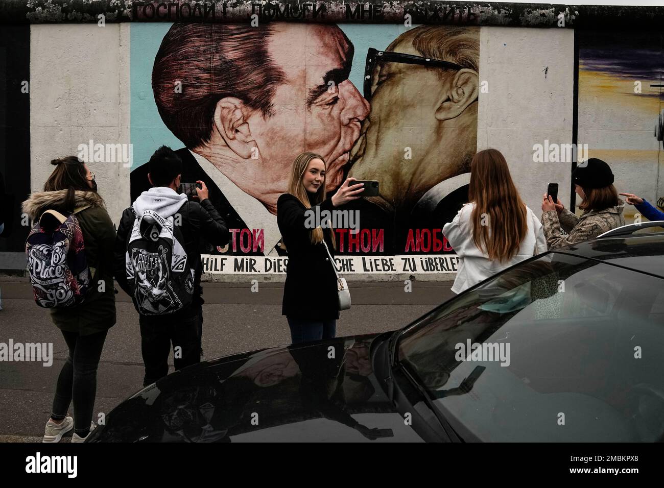 People take pictures of the artwork by Russian artist Dmitry Vrubel ...