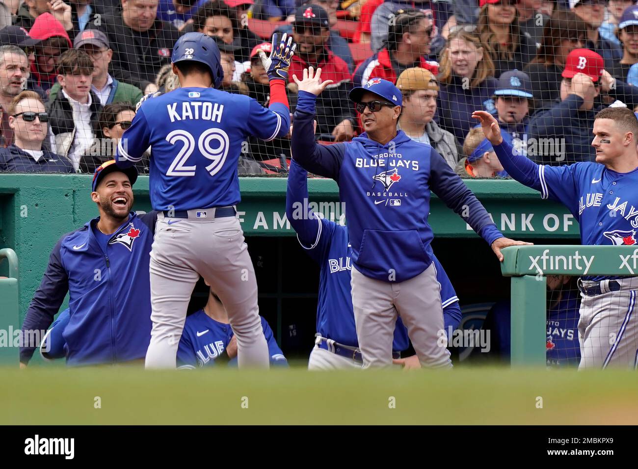 Toronto Blue Jays' Gosuke Katoh (29) is welcomed to the dugout after ...