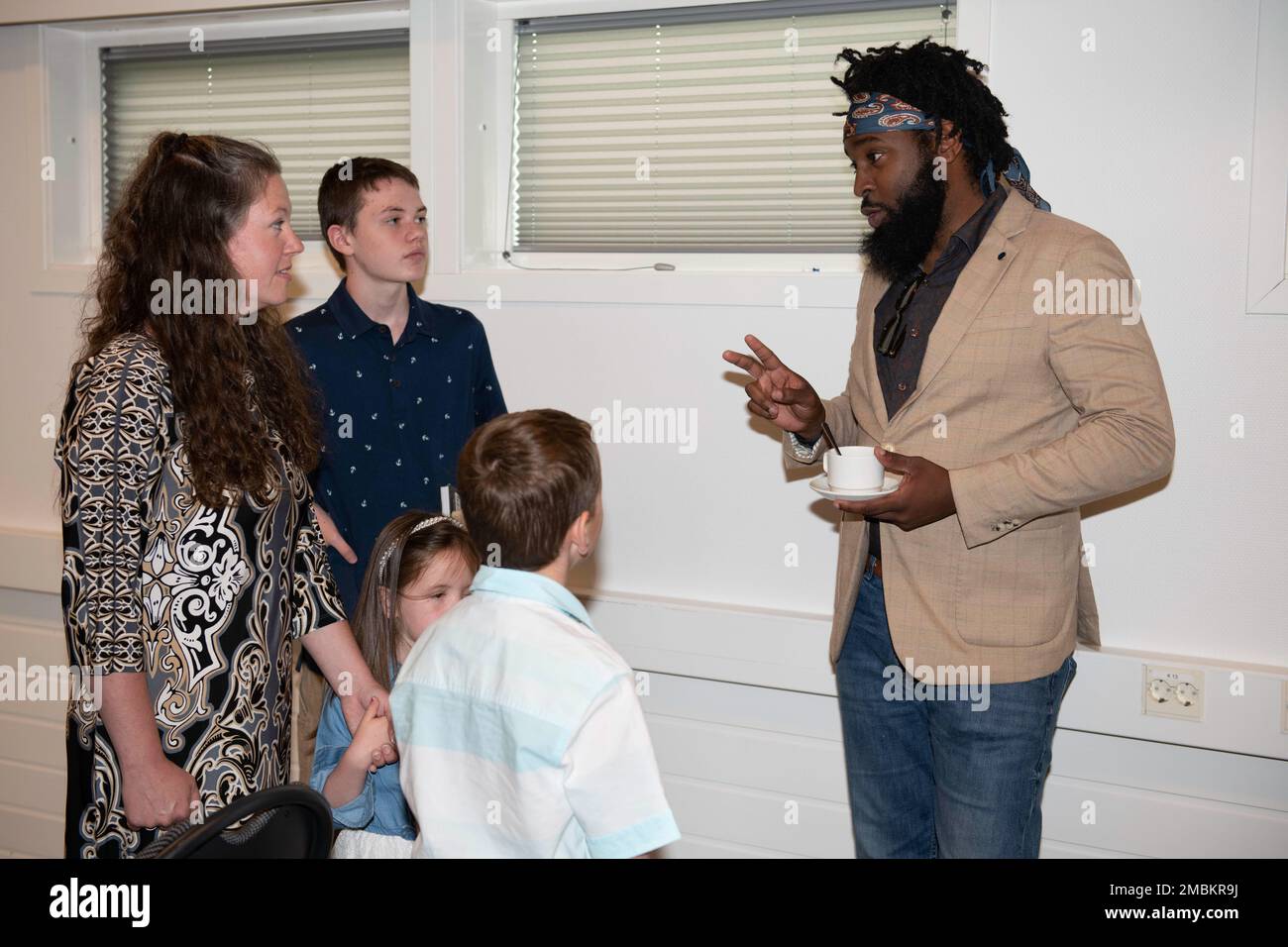 Meguel Copeland, 426th Air Base Squadron services director, greets the ...