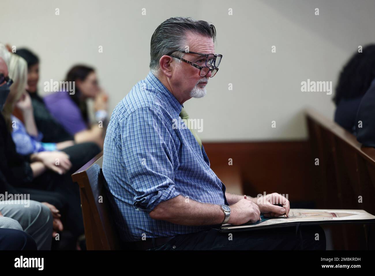 Courtroom sketch artist William J. Hennessy Jr. sits in the courtroom ...