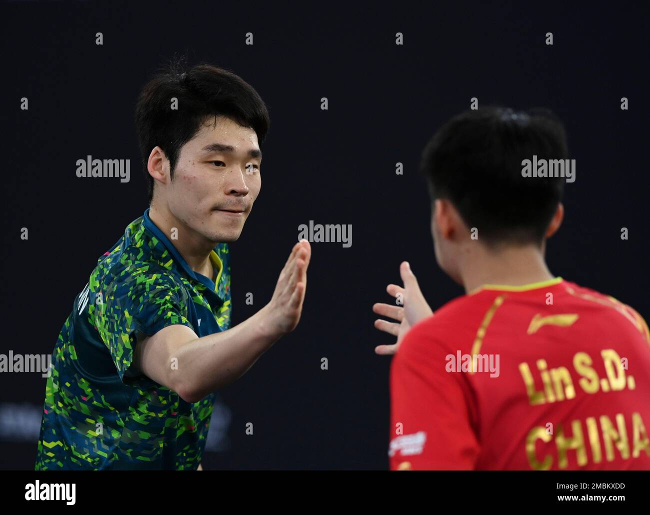 Doha, Qatar. 20th Jan, 2023. Jang Woojin (L) claps hands with Lin ...