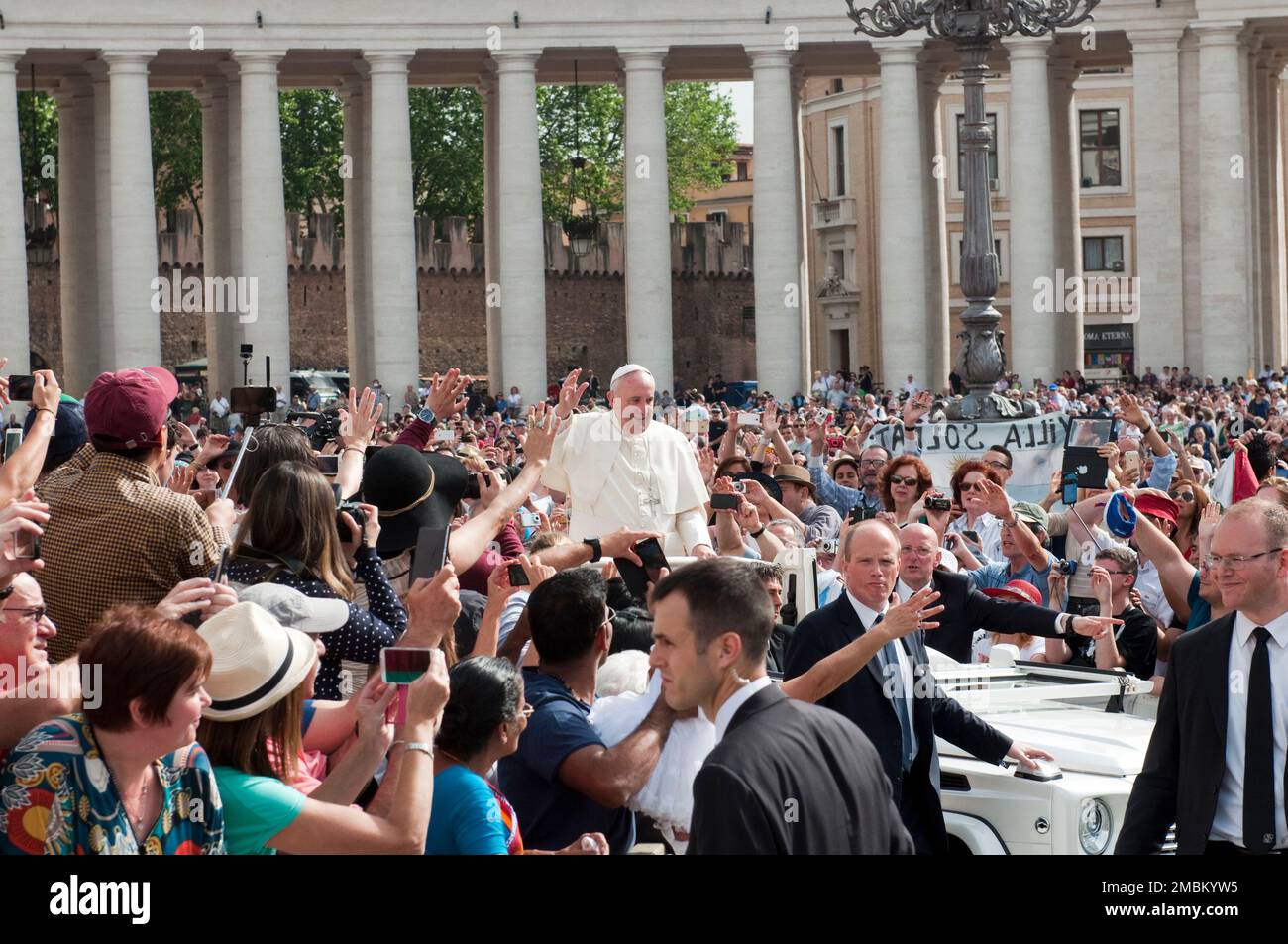 Pope Francis greets visitors to his weekly audience in St. Peter's ...