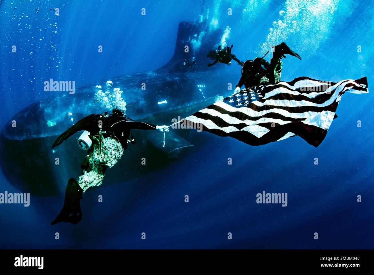 Military members from Naval Special Warfare Group Eight display the ...