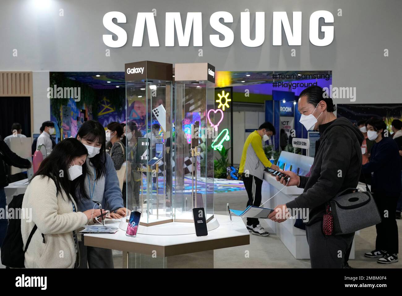Visitors try out Samsung Electronics Galaxy smartphones during the 2022 ...