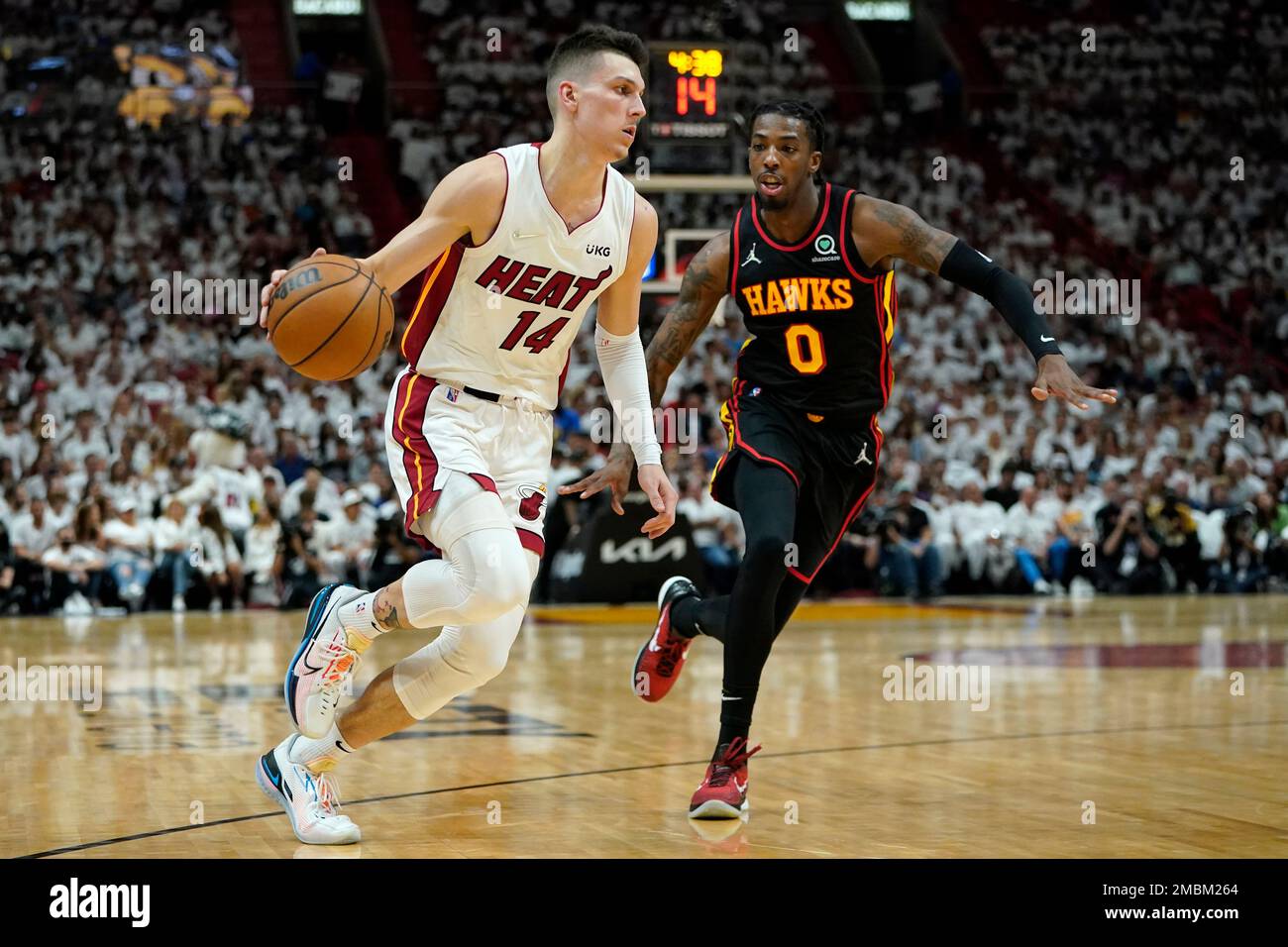 Miami Heat guard Tyler Herro (14) drives to the basket as Atlanta Hawks guard Delon Wright (0 ...