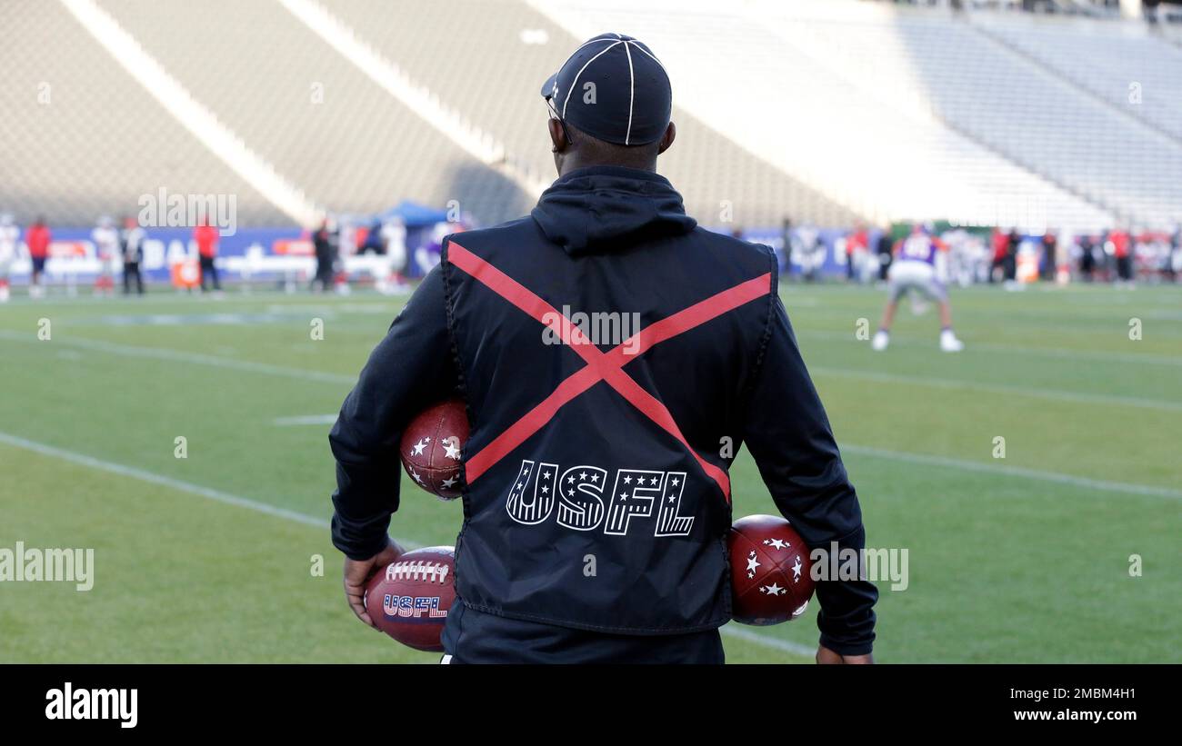 A USFL ball handler during the first half of a USFL football game ...