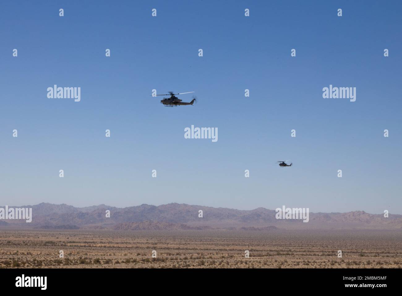 Two U.S. Marine AH-1Z Viper helicopters with Marine Light Attack ...