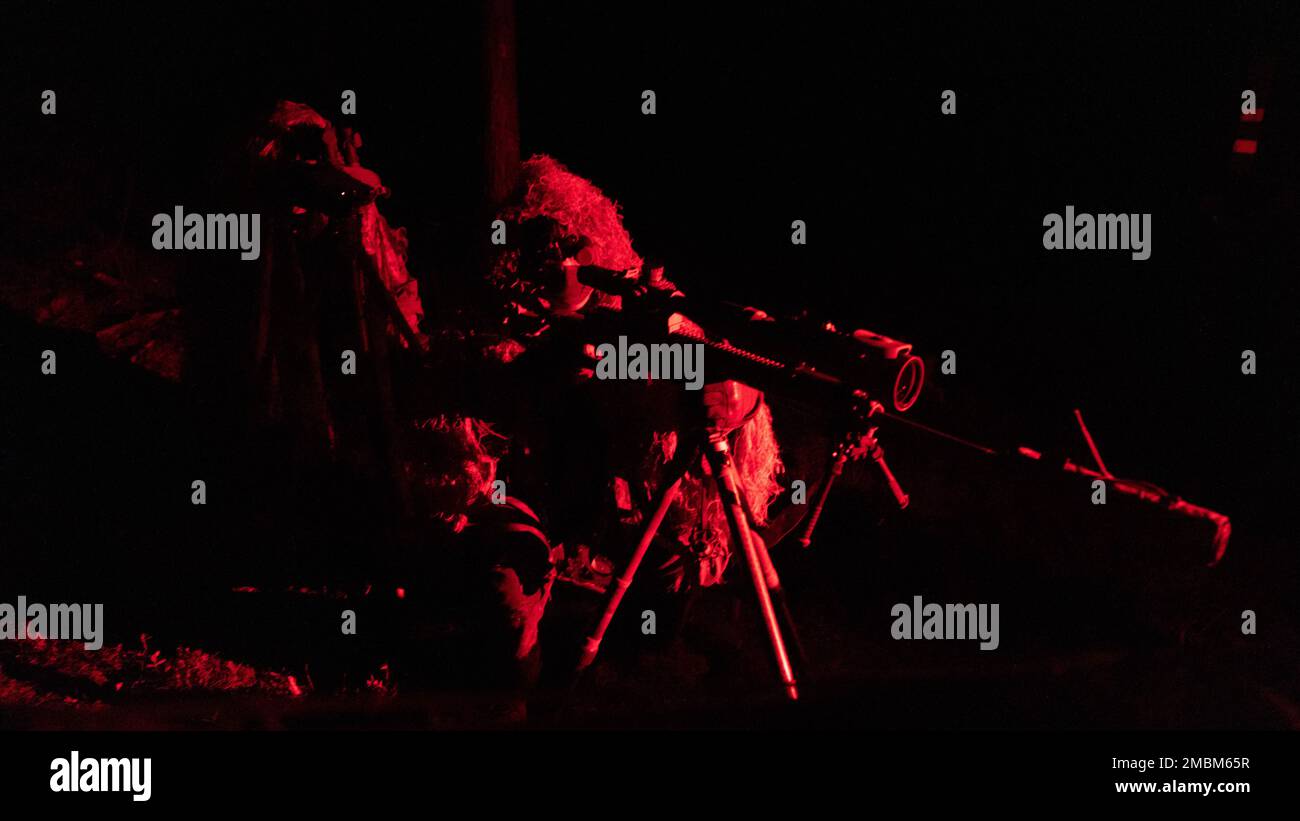 An Italian Special Forces Sniper team prepares to fire upon a high ...