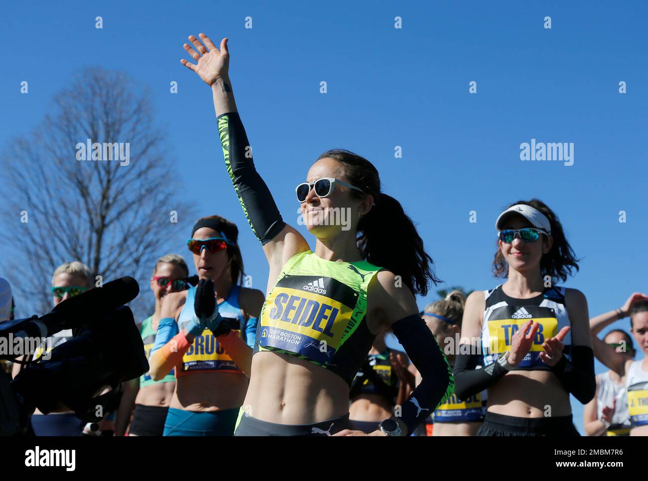 Elite runner Molly Seidel acknowledges supporters as she is introduced ...