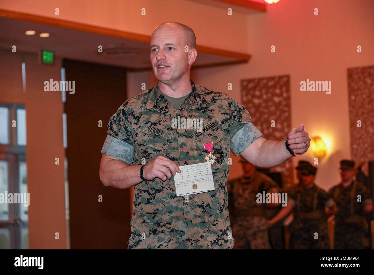 U.S. Marine Corps Col. Lester “Ray” Gerber, addresses the audience ...
