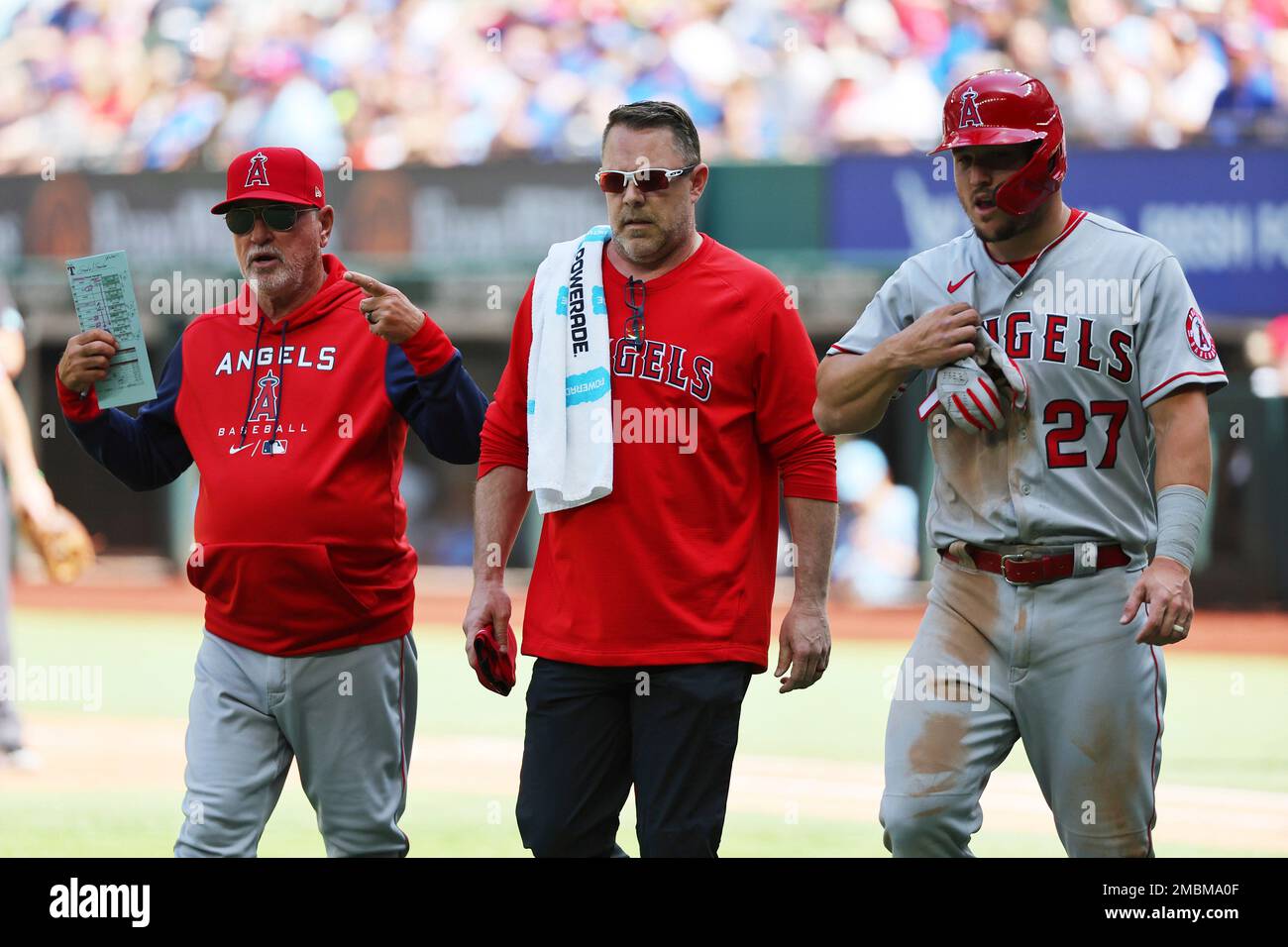 Los Angeles Angels manager Joe Maddon and athletic trainer Mike Frostad ...