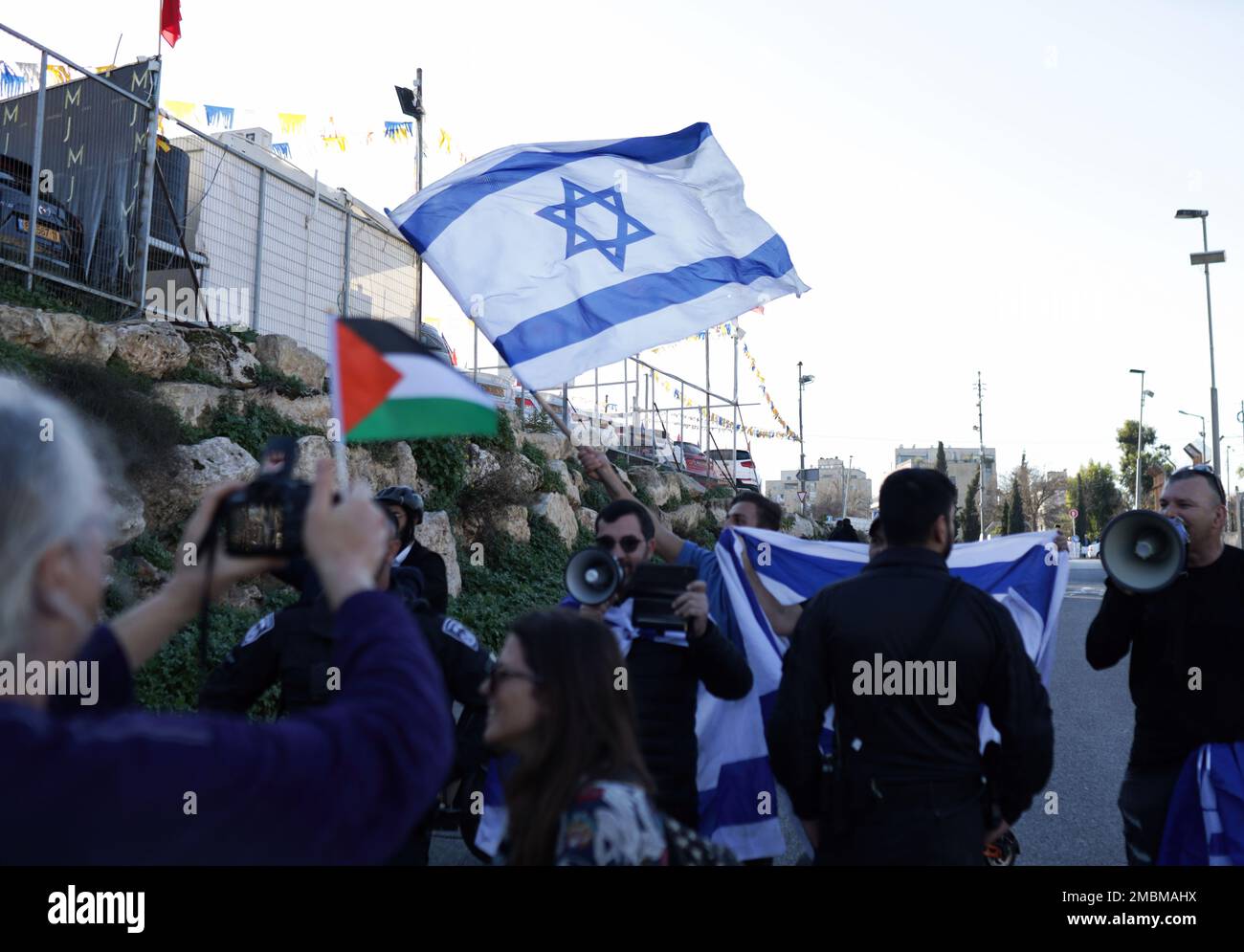 Jerusalem, Israel. 20th Jan, 2023. Protesters wave flags and speak ...