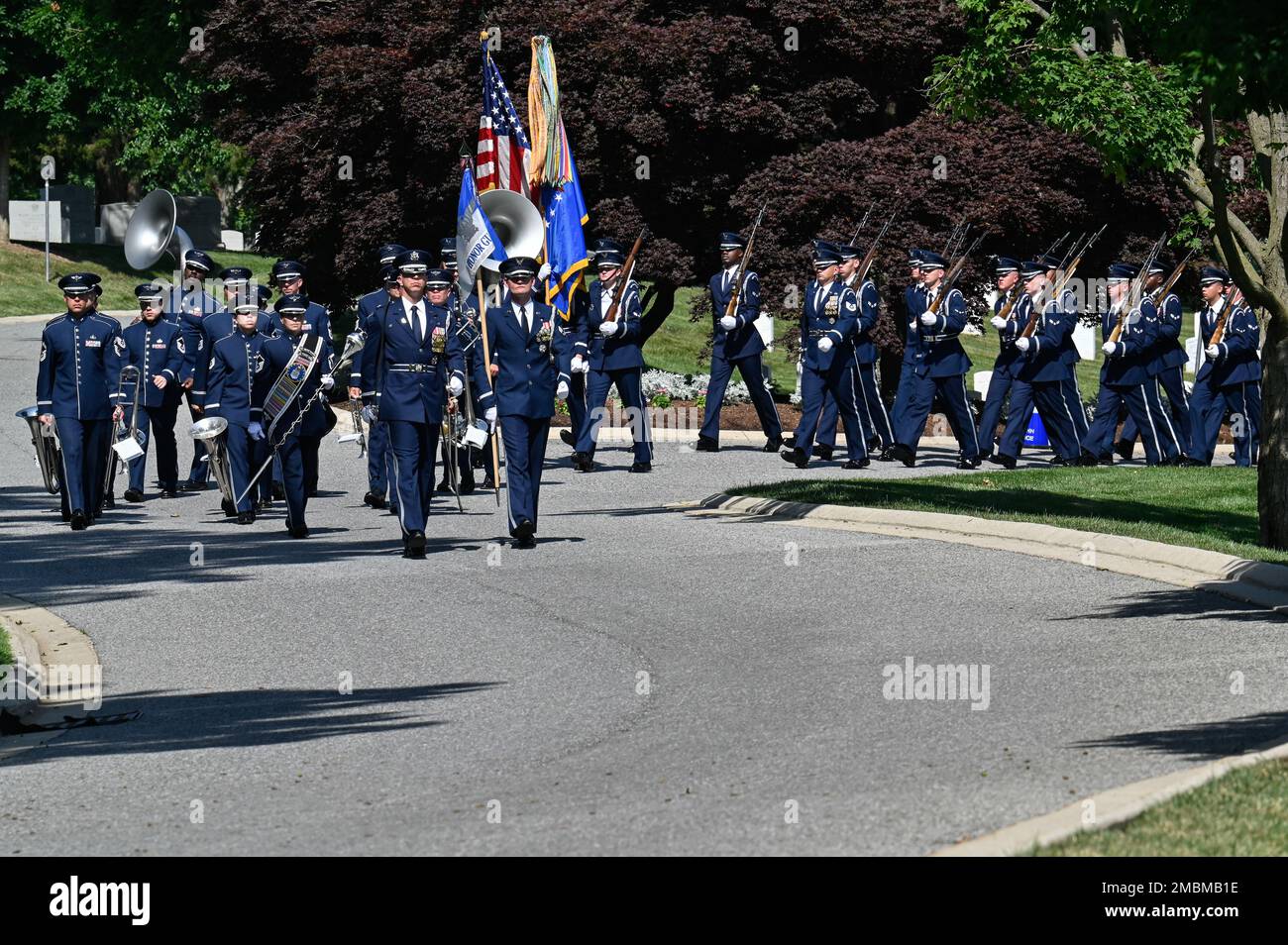 The Air Force Band and Honor Guard march to the gravesite during the ...