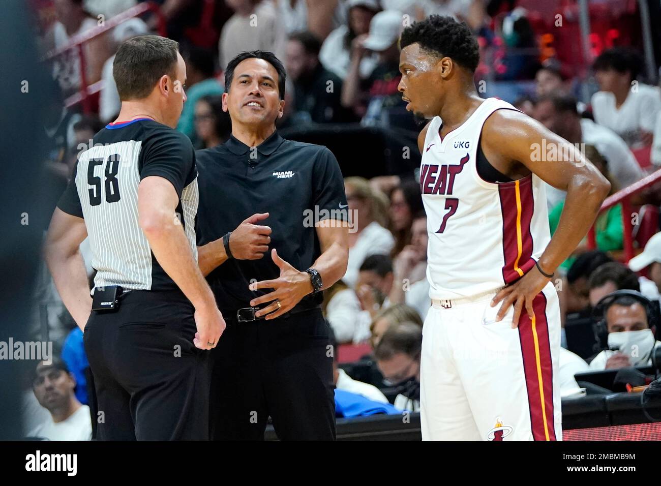 Miami Heat head coach Erik Spoelstra, center, and guard Kyle Lowry (7 ...