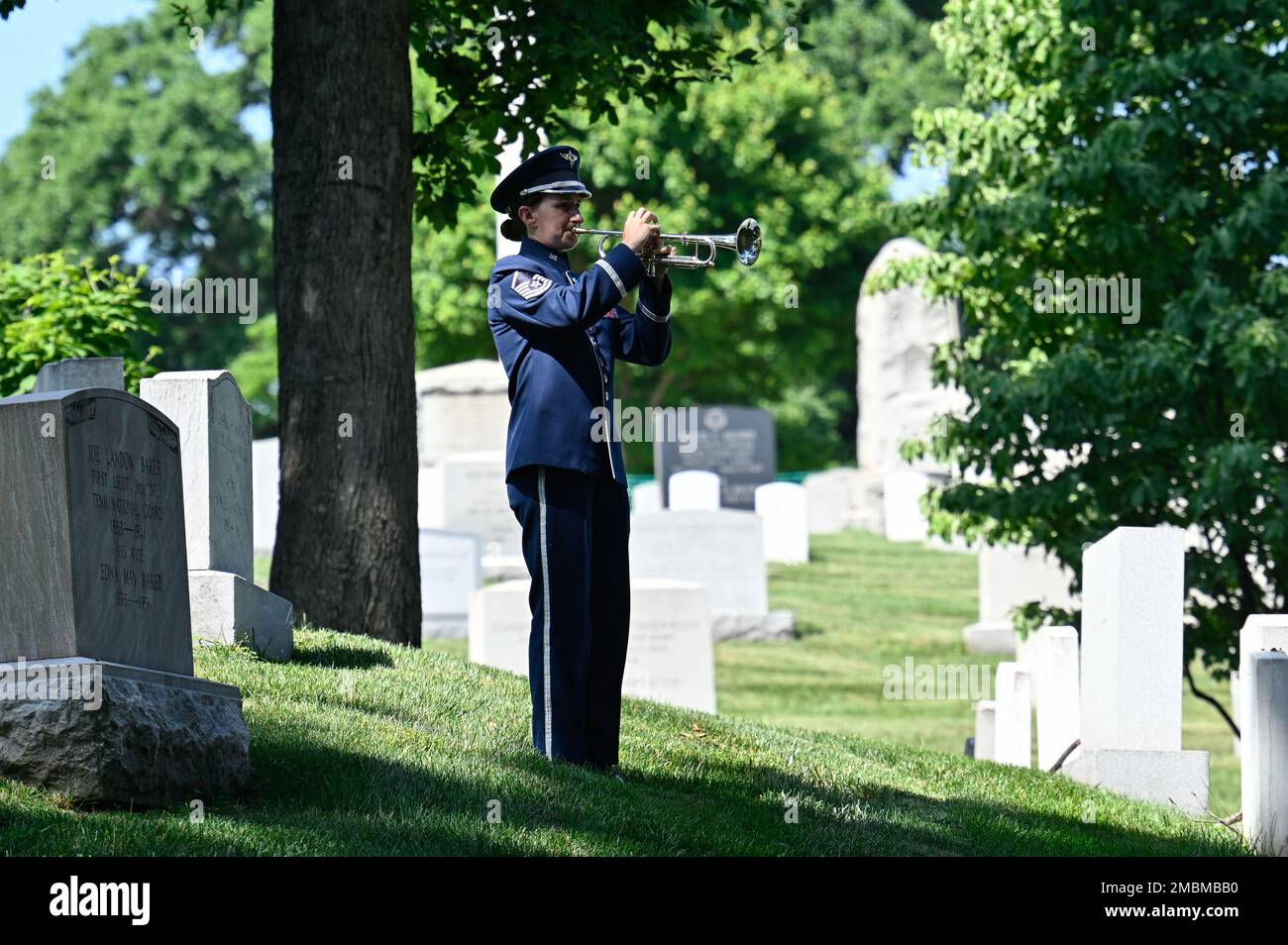 An Air Force bugler plays taps during the funeral of Brig. Gen. Charles ...