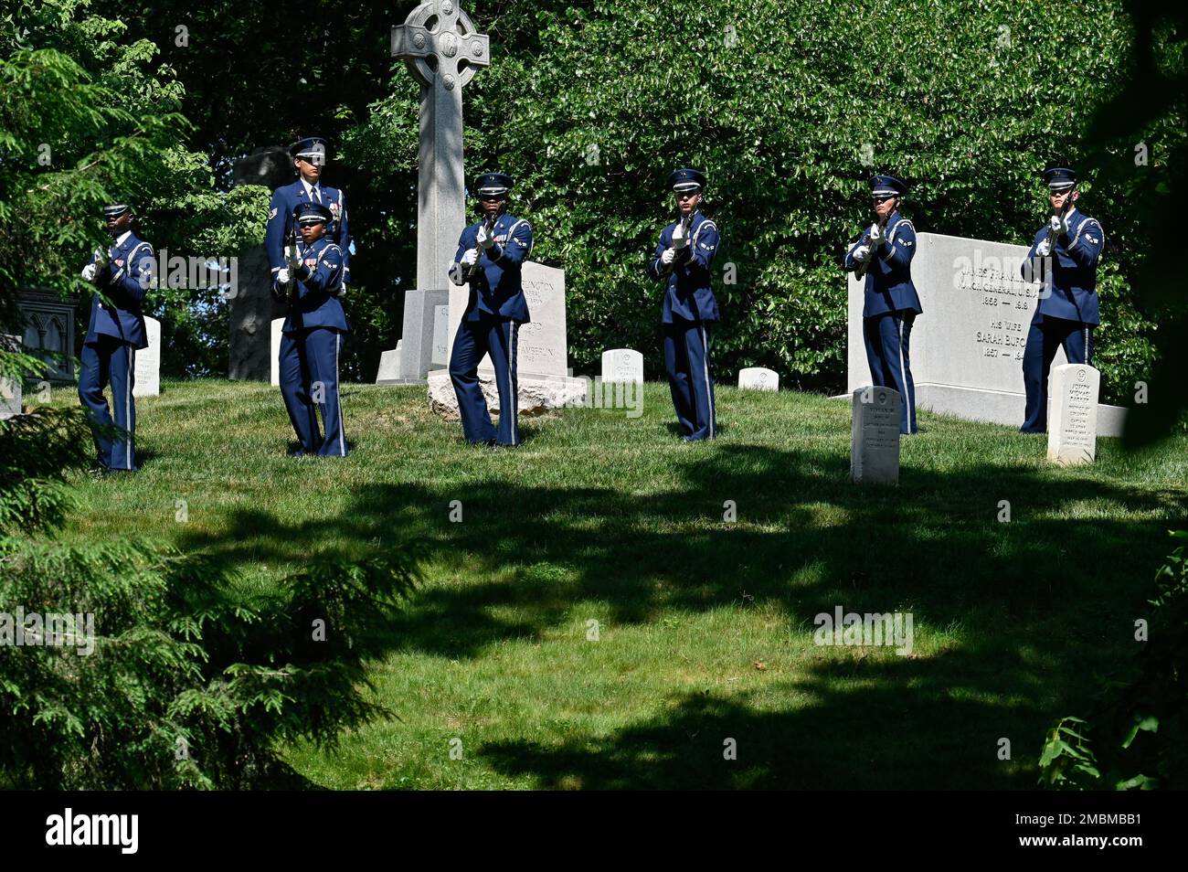 The Air Force Honor Guard fires a three-volley rifle salute during the ...