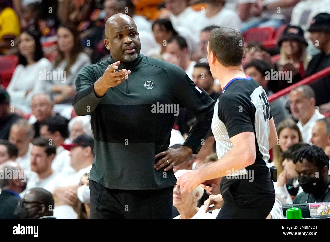 Atlanta Hawks head coach Nate McMillan talks with official Josh Tiven ...