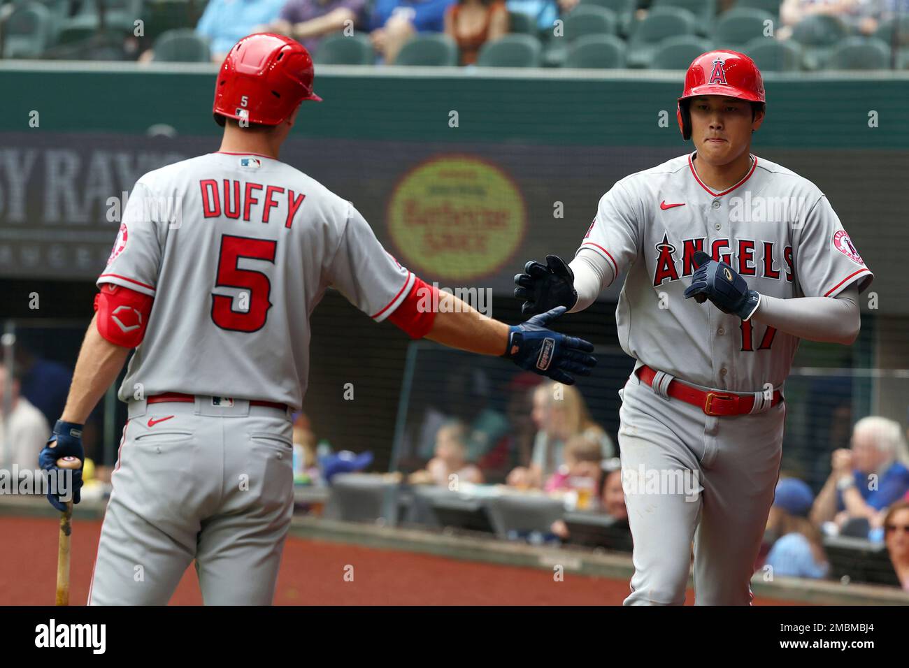 Los Angeles Angels' Matt Duffy (5) greets Shohei Ohtani (17) after he ...