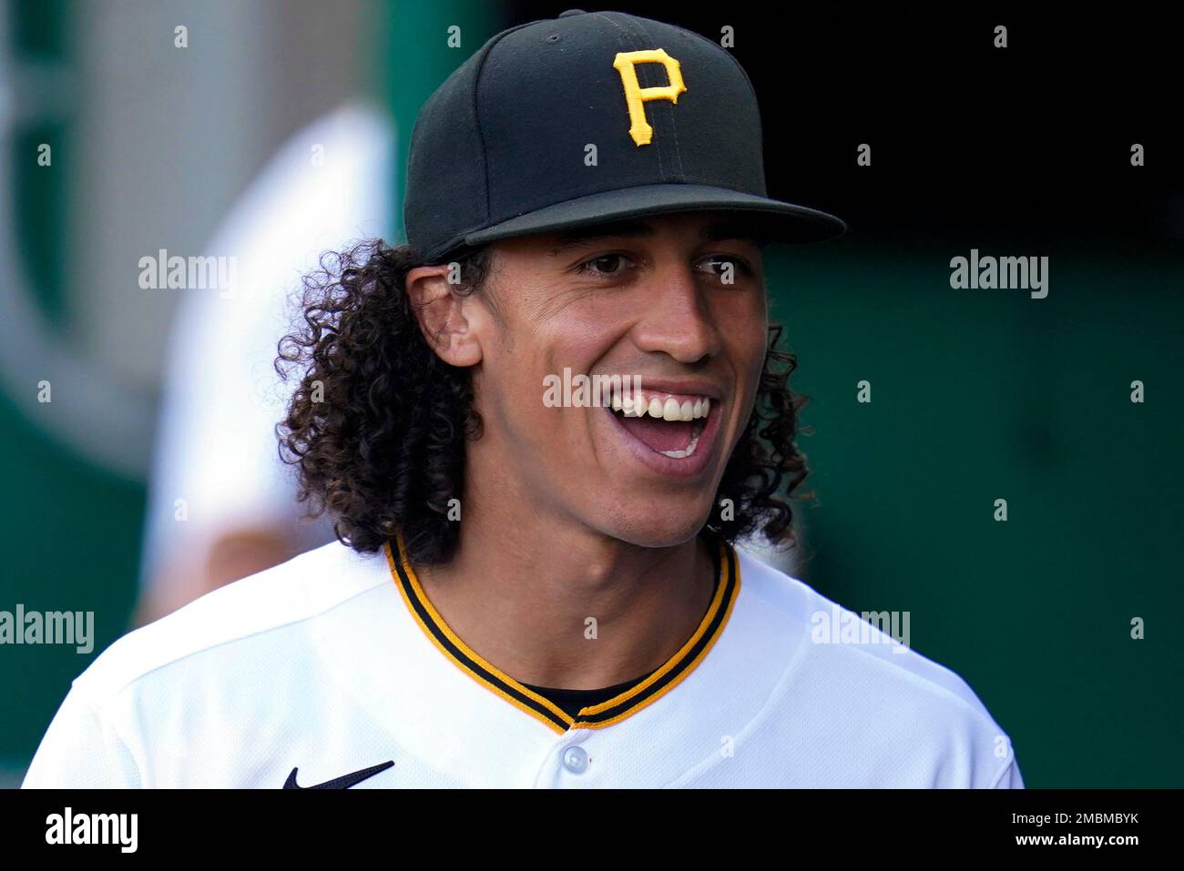 Pittsburgh Pirates' Cole Tucker walks in the dugout before a baseball ...