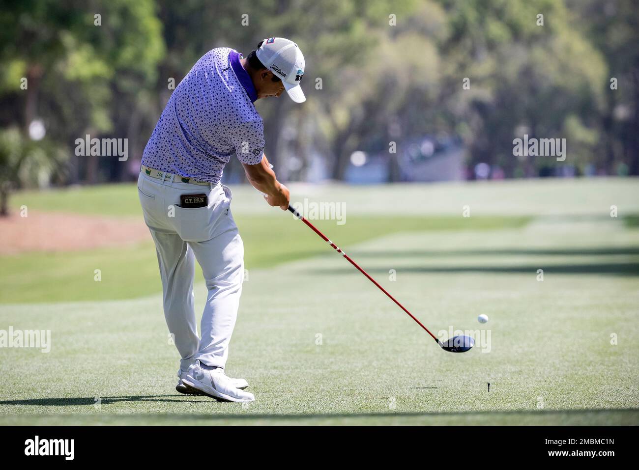 C.T. Pan, of China, hits off the 15th tee during the final round of the ...