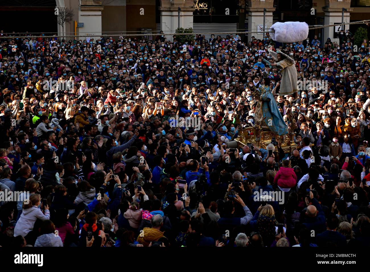 7-year-old Veronica Serrano, secured by a harness, is transported in ...