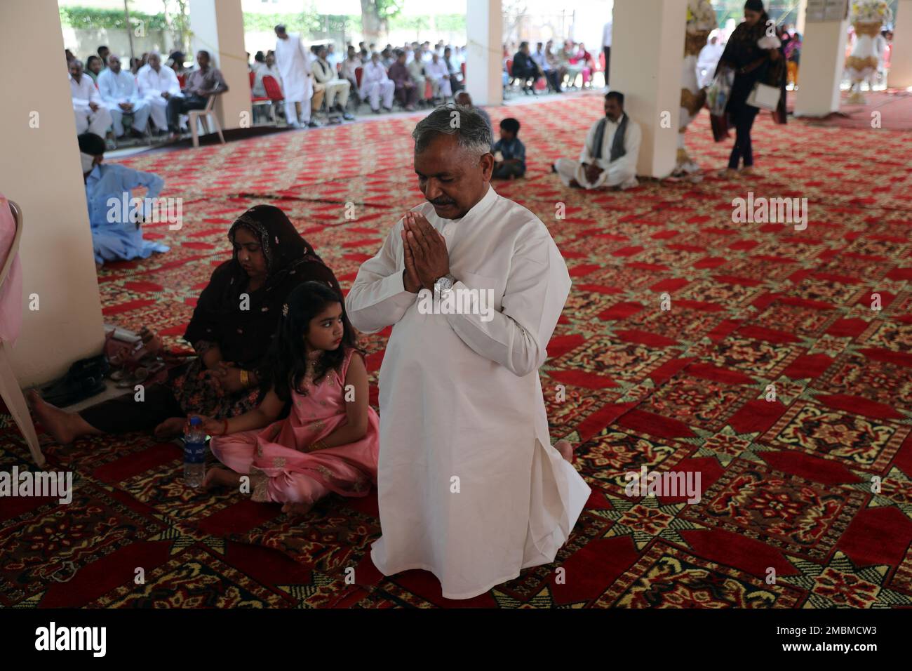 A Christian man prays during an Easter mass in Our Lady of Fatima ...