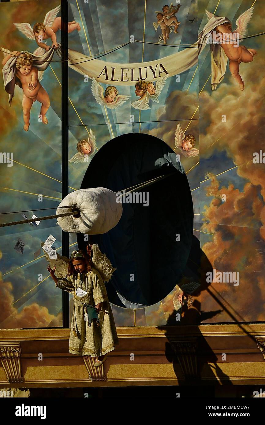 7-year-old Veronica Serrano, secured by a harness, is transported in ...