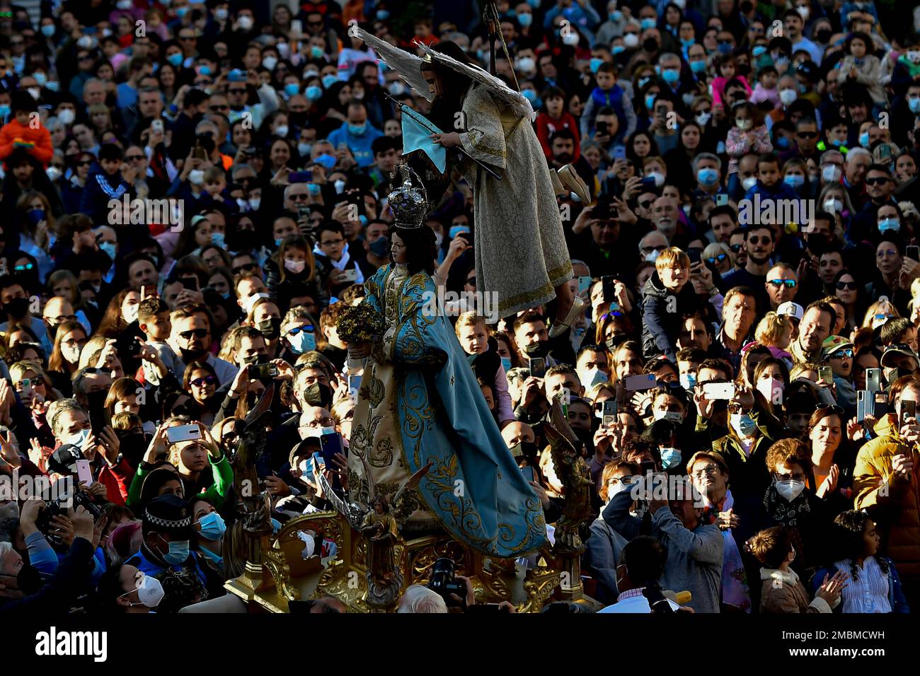 7-year-old Veronica Serrano, secured by a harness, is transported in ...
