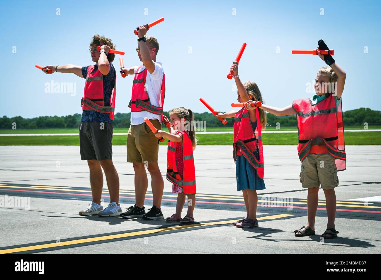 Lt. Col. Karl Duerk’s kids help signal to park the jet, June 17, 2022 ...