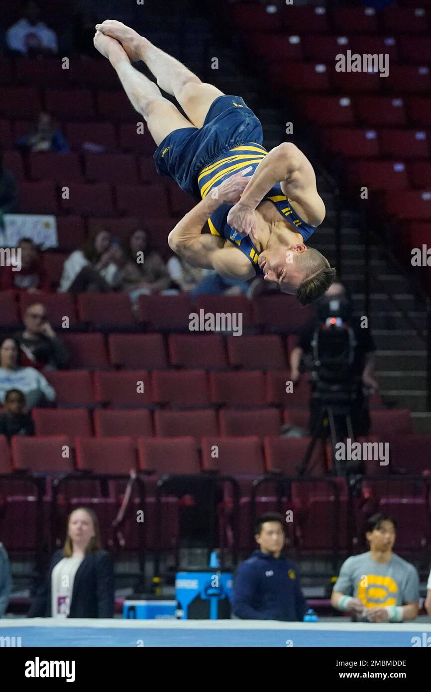 Michigan's Paul Juda competes in the floor exercise during the NCAA ...