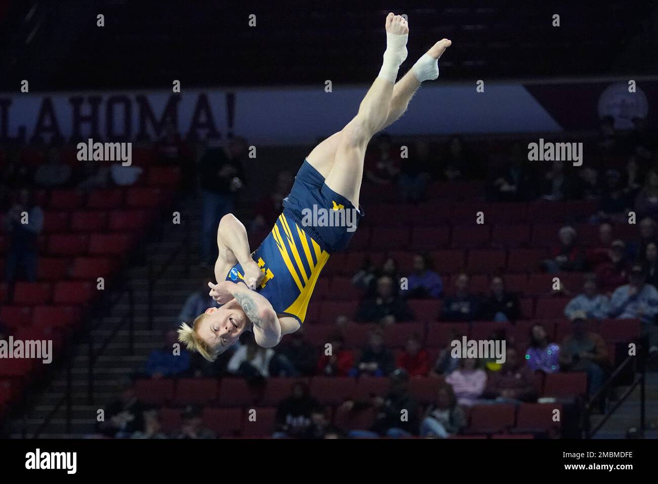 Michigan's Cameron Bock competes in the floor exercise during the NCAA ...