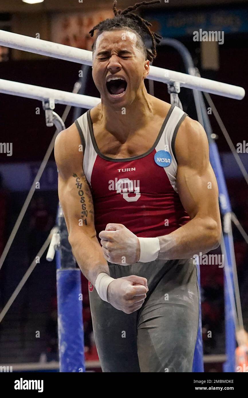 Oklahoma's Raydel Gamboa reacts after competing on the parallel bars ...