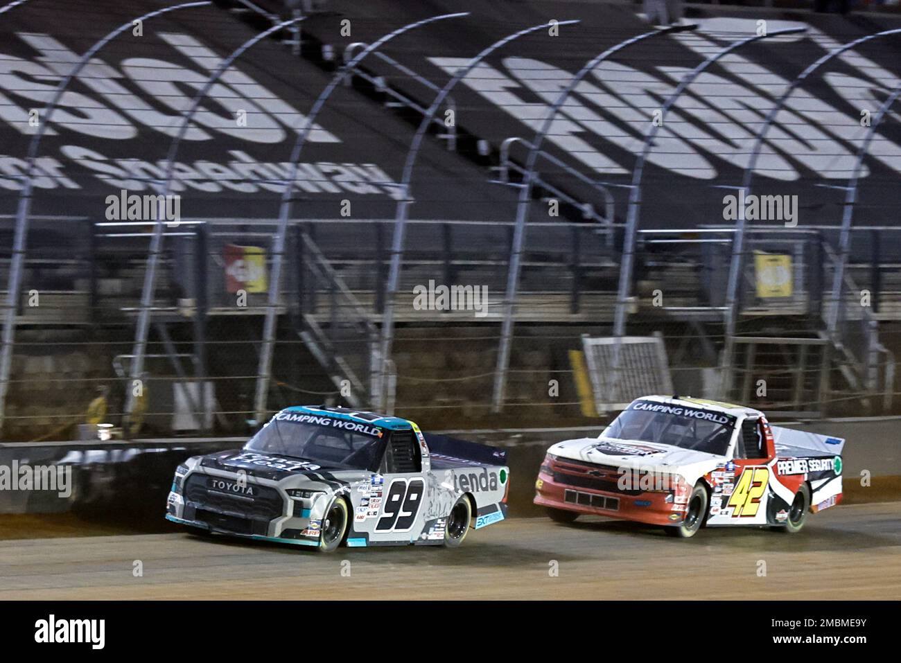 Ben Rhodes (99) drives in front of Carson Hocevar (42) during the ...