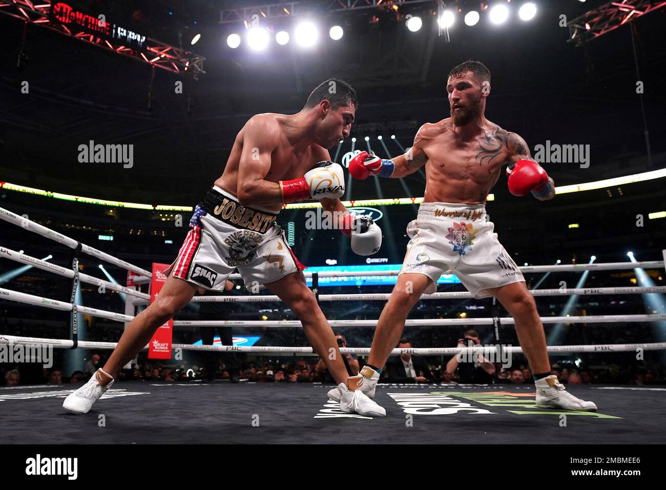Cody Crowley, right, from Canada, and Josetito Lopez exchange punches ...