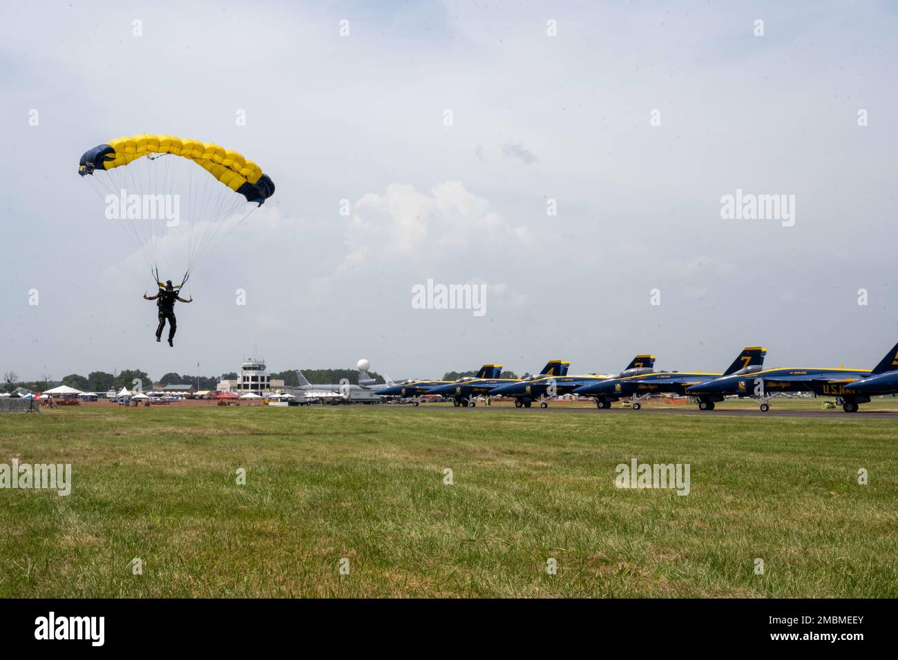 Members of the Navy Parachute Team, the “Leap Frogs,” parachute into ...